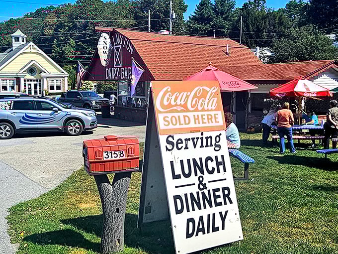 "Coca-Cola Sold Here" announces the vintage sign, while picnic tables await hungry visitors ready to experience Vermont's most beloved roadside treasure.