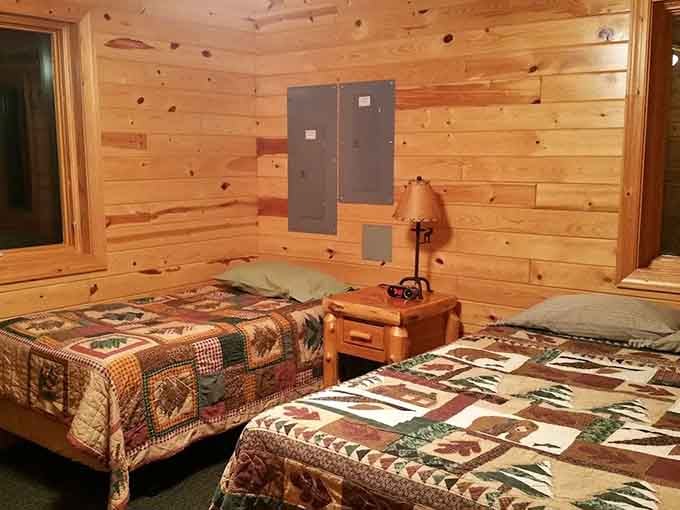 These cozy cabin bedrooms prove that rustic charm and actual comfort can absolutely be roommates, with warm wood tones that practically hug you goodnight.