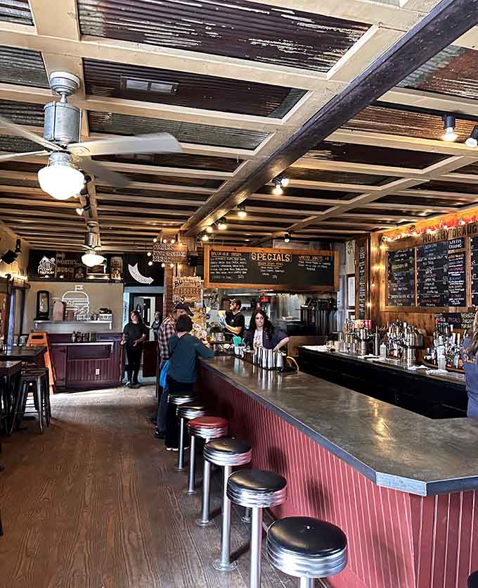 Chrome stools and chalkboard menus create that perfect diner vibe where comfort food meets craft, no white tablecloths required.