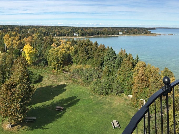 A breathtaking autumn view from the lighthouse gallery reveals the stunning colors of Door County's shoreline meeting Lake Michigan's blue waters.
