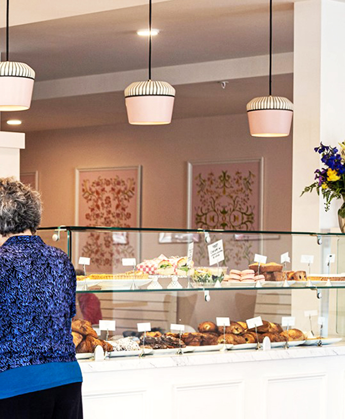Welcome to carb heaven! This display case is like a treasure chest for your taste buds, each pastry a golden ticket to buttery bliss.