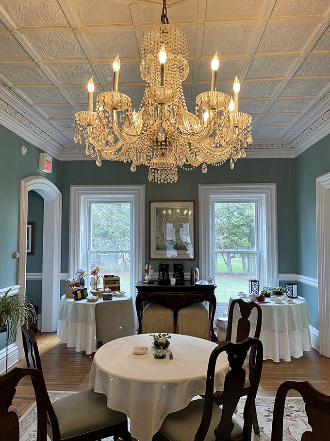 Crystal chandeliers dance above elegant table settings, creating an atmosphere where breakfast feels like a royal affair.