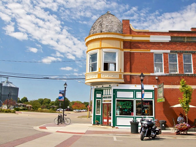 Architectural delight: The distinctive yellow corner building with its rounded turret stands as a testament to Utica's preserved historical character.