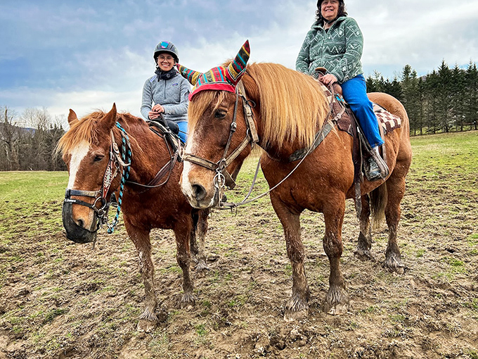 Majestic horses await their riders, each sporting colorful saddle blankets that add personality to these gentle four-legged tour guides.