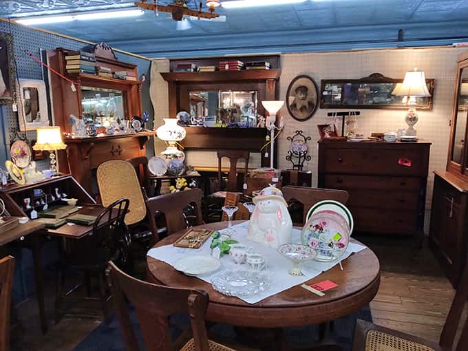 Sunlight dances across the ornate tin ceiling, illuminating a wonderland of glass cases where yesterday's treasures await new homes and fresh stories.