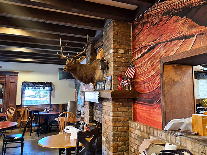 Step inside to discover rustic charm complete with mounted elk, brick fireplace, and the promise of comfort food that satisfies the soul.