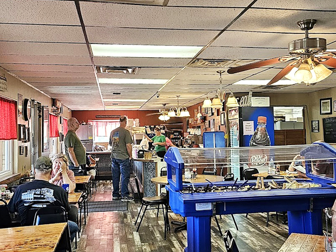 Inside, the no-frills dining area buzzes with conversation while the aroma of fried chicken fills every corner.