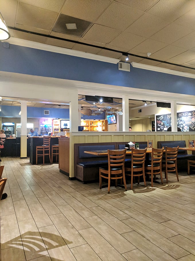 Blue walls and wooden accents create that perfect "coastal casual" vibe where memorable meals and conversations naturally flow.