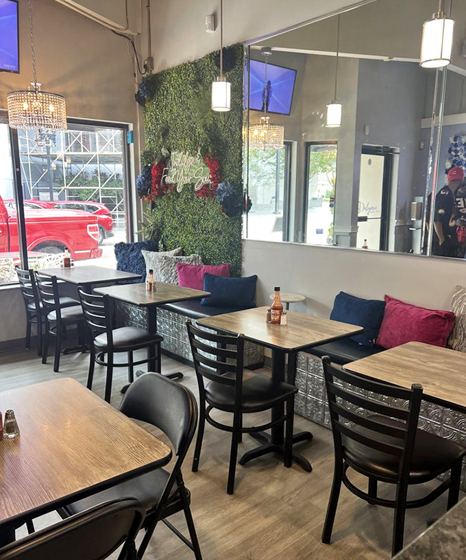 Cozy wooden tables nestled against a living green wall create the perfect setting for indulgent Southern fare that'll make you want to linger all afternoon.