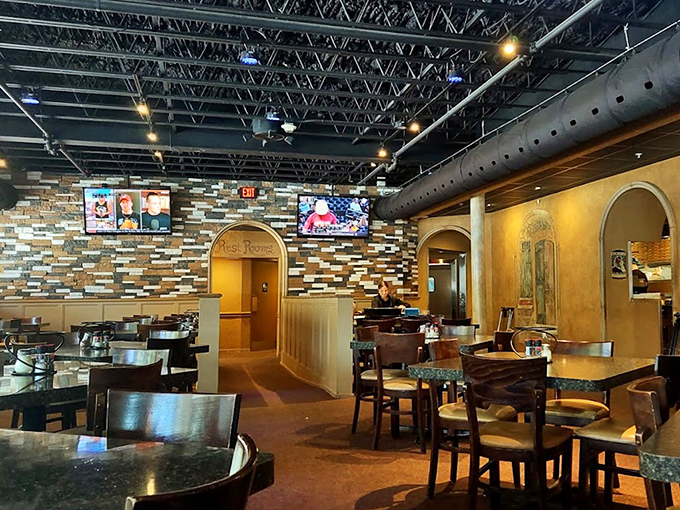 Warm earth tones and textured walls create an atmosphere that's both upscale and comfortable&mdash;like Italy's living room transplanted to Florida.