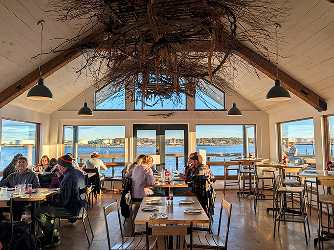 Vaulted ceilings, rustic beams, and panoramic harbor views &ndash; dining here feels like floating on Casco Bay itself.
