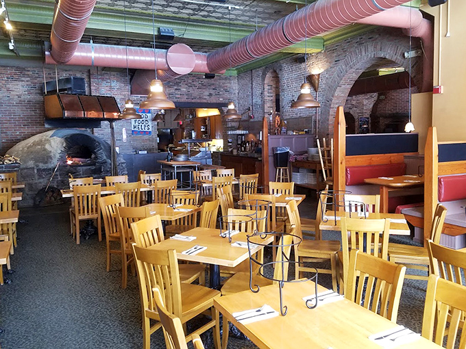 Industrial-chic meets cozy comfort in this dining room where the star of the show&mdash;that magnificent wood-fired oven&mdash;commands attention like a culinary celebrity.