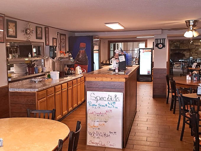 Rustic wooden shelves and industrial lighting create a warm, inviting atmosphere that perfectly complements the artisanal chocolates.