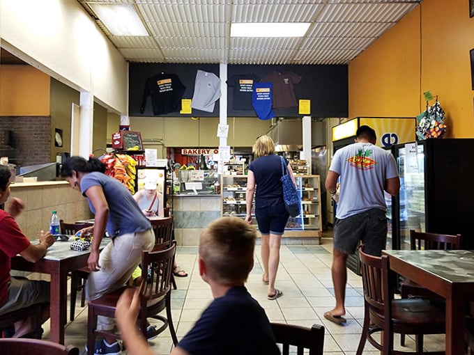 Inside Myer's, the bustling counter area hums with activity as hungry patrons line up for their fix of wood-fired delights.