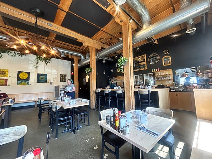 Exposed wooden beams and brick walls create that rare atmosphere where industrial meets cozy &ndash; like a hug in architectural form.