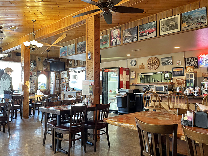 Warm wood paneling and classic diner charm create the perfect backdrop for memorable meals, where every corner tells a story of American road trip nostalgia.