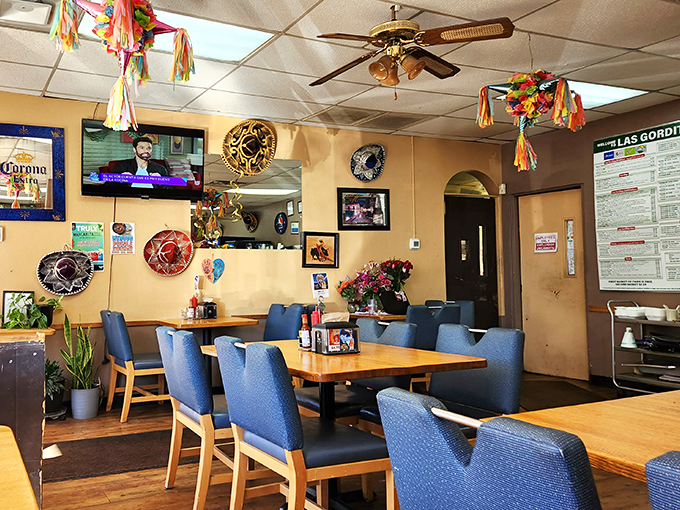Warm yellow walls, colorful decorations, and blue chairs create the perfect unpretentious backdrop for the flavor explosion that's about to happen.