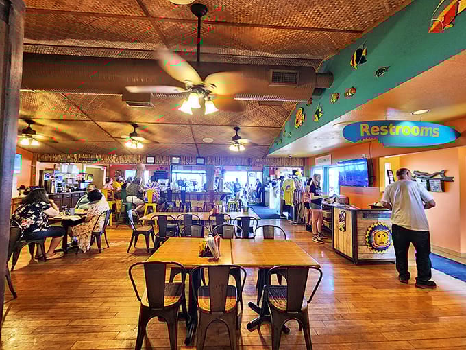 Inside Dock's Beach House, tropical vibes meet lakeside charm with bamboo ceilings, colorful fish decor, and an atmosphere that whispers "vacation."