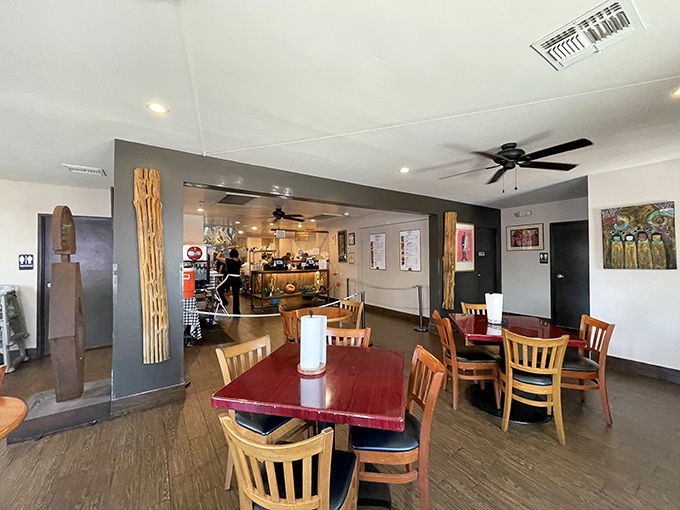 Simple wooden tables and chairs create a homey atmosphere where the food, not fancy decor, takes center stage.