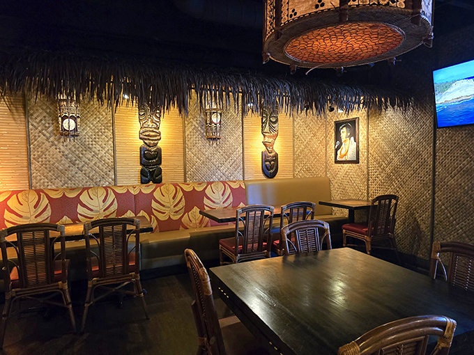 Step inside and be transported to a Polynesian paradise, where bamboo walls, tiki statues, and woven textures create an authentic island atmosphere.