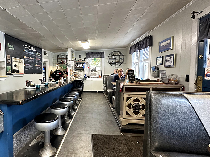 Classic diner counter with those spinning stools that transport you straight back to simpler times when breakfast meant something and menus weren't the size of novels.