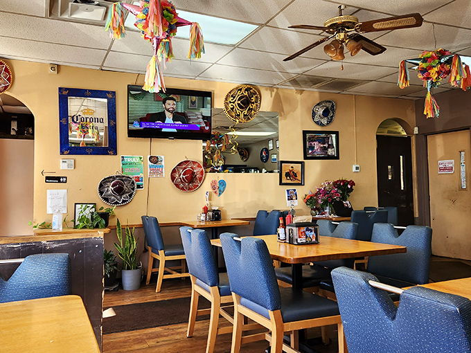 Inside Las Gorditas, colorful decorations and comfortable blue chairs create that "abuela's dining room" vibe where memorable meals happen.