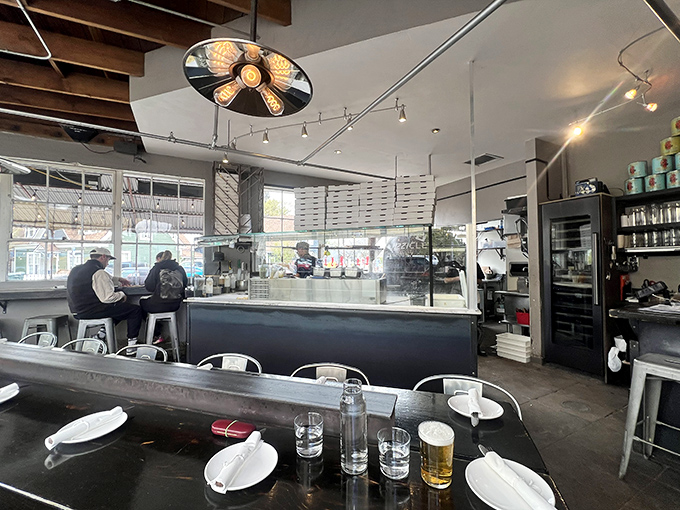 Minimalist interior design puts the focus where it belongs: on the magnificent wood-fired oven and the pizza-making magic happening before your eyes.