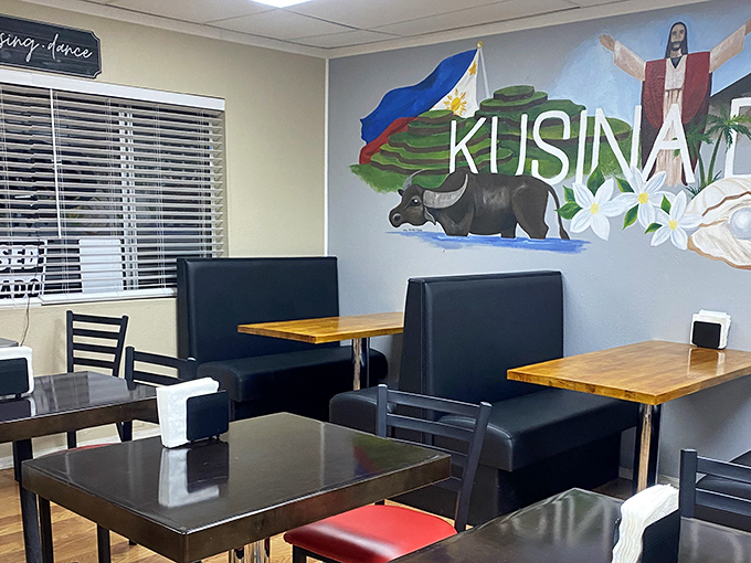 Step inside to a world of Filipino flavors. The colorful mural featuring the Philippines' flag and cultural symbols sets the perfect backdrop for your culinary journey.