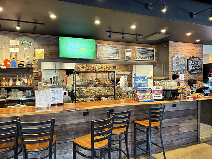 The heart of bagel operations: wood-fired magic happens behind this rustic counter where dough transforms into crusty, chewy perfection.