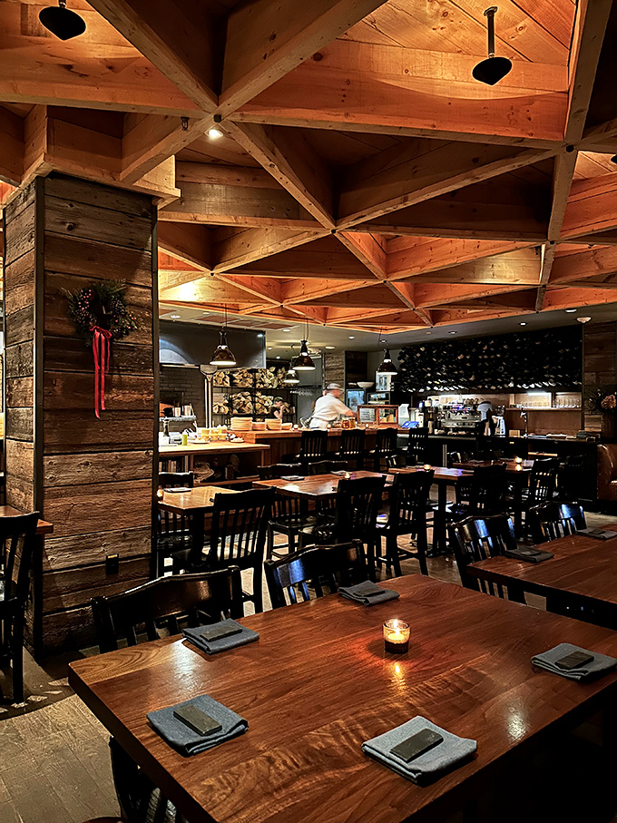 The geometric wooden ceiling creates a warm, intimate atmosphere that's somehow both rustic and sophisticated – Vermont dining at its finest.