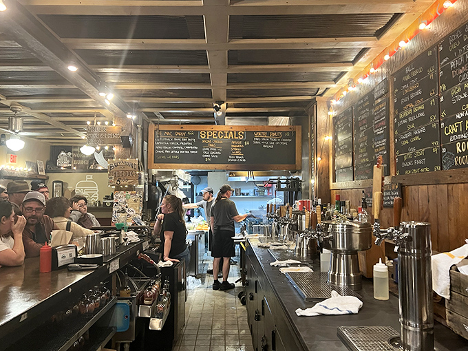 Inside, the bustling counter service reveals a Vermont institution in action &ndash; chalkboard menus, wooden beams, and the unmistakable energy of people about to eat very well.