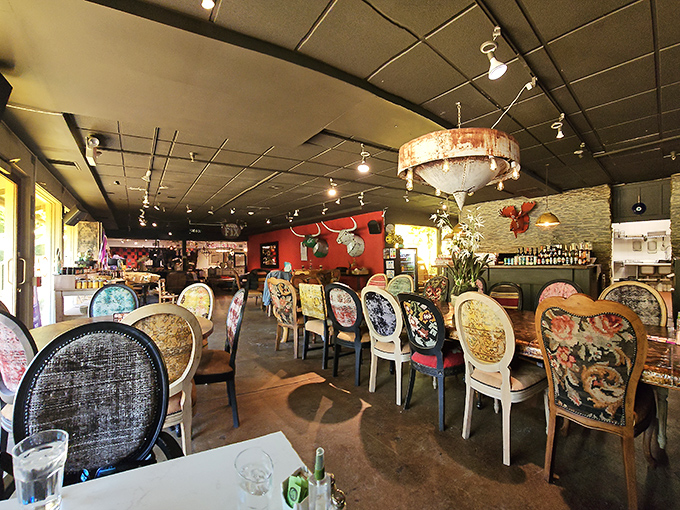 Eclectic chairs tell their own stories around each table, while mounted antlers watch over diners in this whimsical furniture-meets-food wonderland.