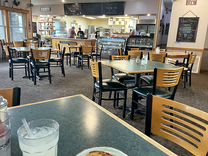 The dining area strikes that perfect balance between spacious and cozy, where conversations flow as freely as the coffee.