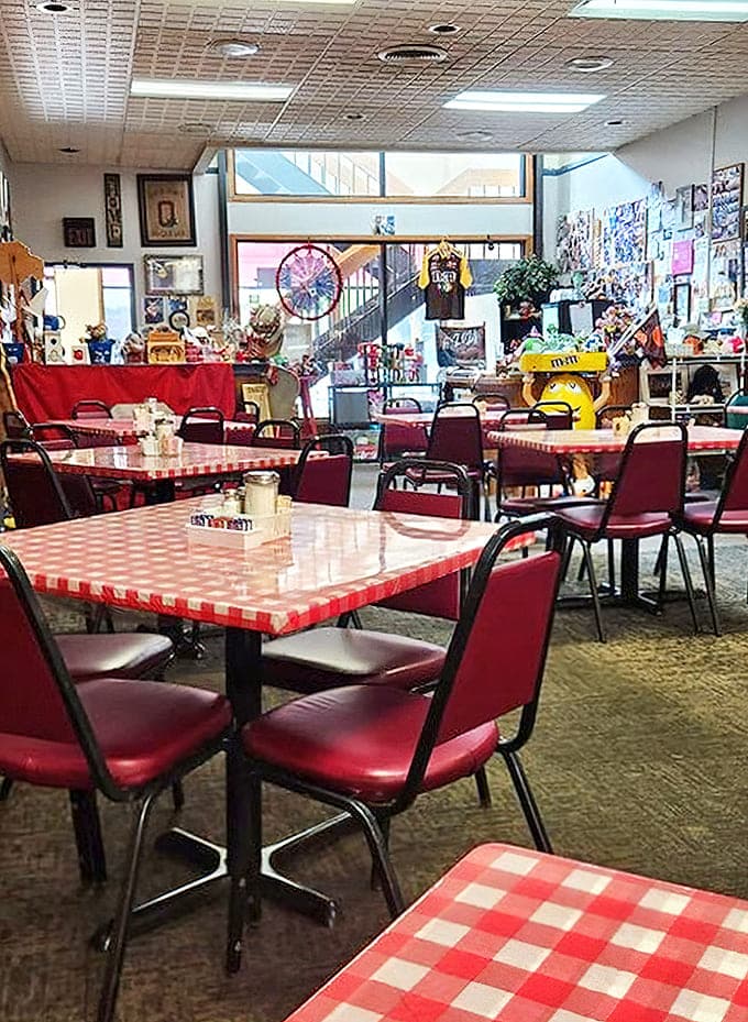 Red checkered tablecloths and vinyl chairs create the perfect backdrop for comfort food conversations and lingering local gossip.