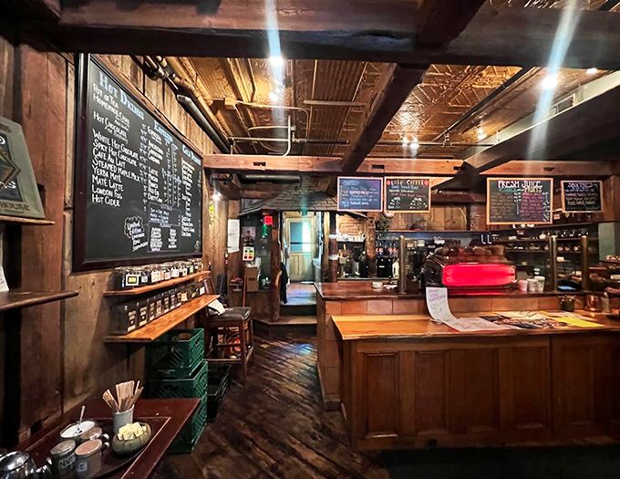 Step into a caffeine-fueled wonderland where mismatched chairs and chalkboard menus create a vibe that's part treehouse, part philosopher's den.