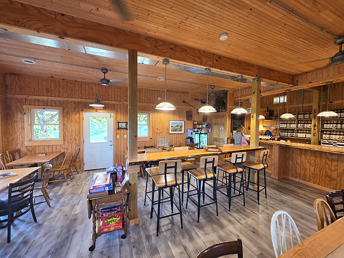 Warm wooden paneling and cozy seating create an atmosphere that feels like wine country's most welcoming living room, complete with bar seating for intimate tastings.