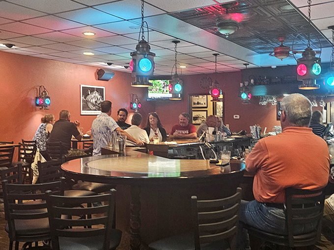 Inside the bar area, vintage railroad lanterns cast a colorful glow, turning everyday drinks into special occasions worth savoring.