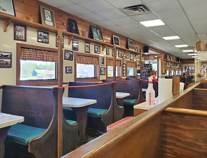 Classic diner booths lined with photos tell stories of decades past &ndash; each frame a chapter in Moody's delicious history.
