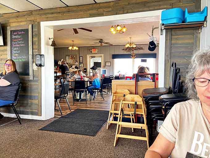 Where comfort meets casual charm – the dining room buzzes with conversation while sunlight streams through windows framing those million-dollar lake views.