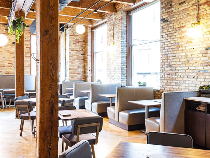 Exposed brick walls and wooden beams create a sanctuary of warmth and style. This isn't just dining &ndash; it's time travel to a European bistro.