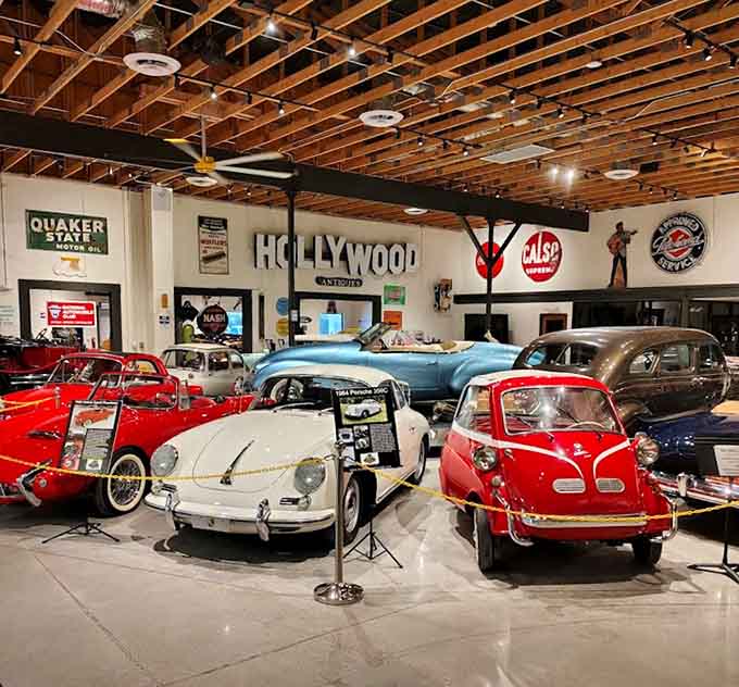 Rows of pristine classics create a kaleidoscope of automotive history under one roof, each vehicle a masterpiece in metal.