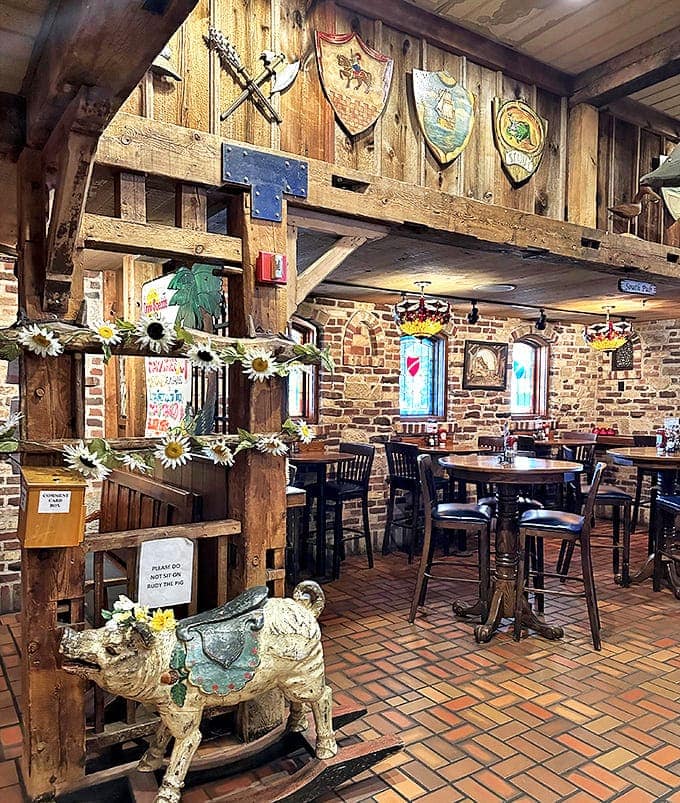 Rustic wooden beams, stone walls, and medieval shields transform this dining space into an authentic English tavern experience.