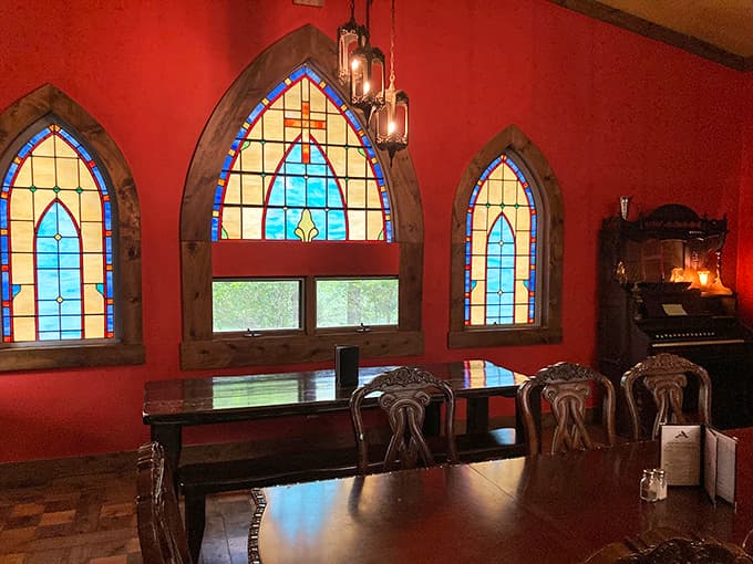 Stained glass windows cast kaleidoscopic light across wooden tables where modern-day knights and ladies gather for feasts and fellowship.