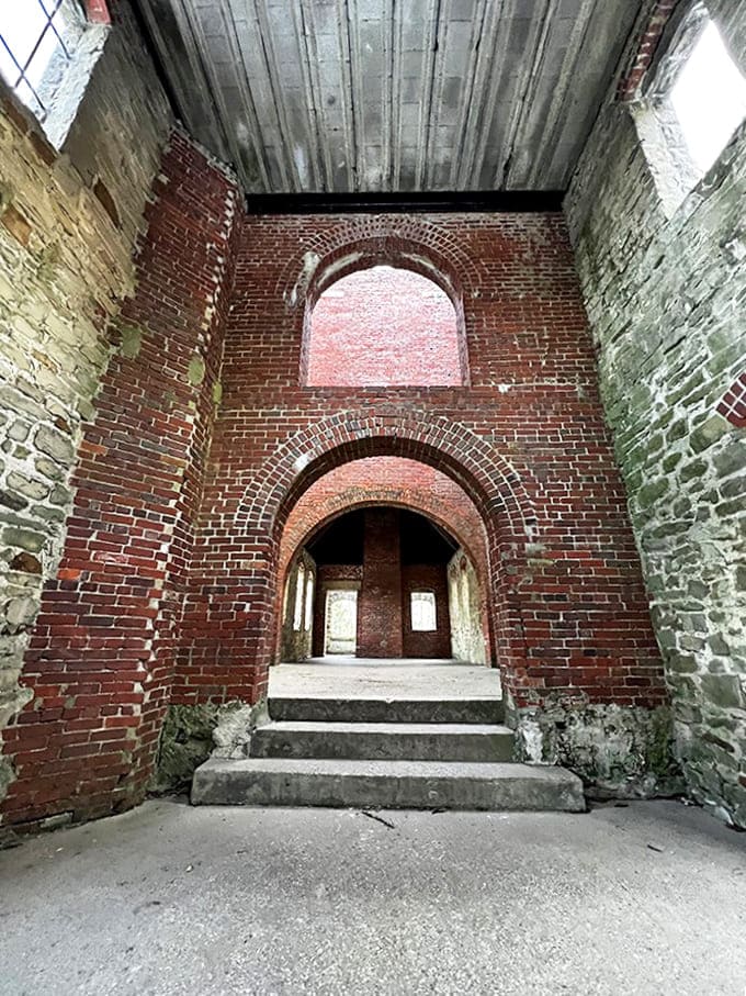 Step inside history's hollow embrace &ndash; brick archways frame emptiness where once the wealthy walked, now filled only with echoes and imagination.