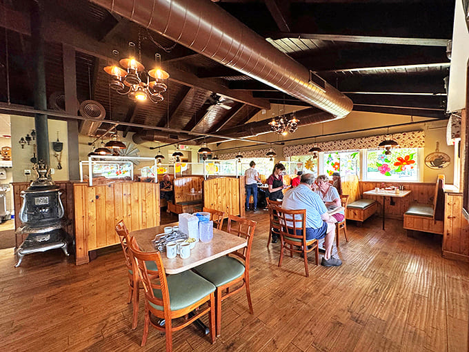 Warm wooden booths and exposed ceiling beams create that perfect "grandma's kitchen" vibe that makes every meal feel like coming home.