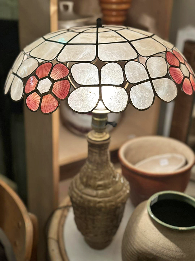 This delicate stained-glass lamp transforms ordinary light into a warm, patterned glow – the kind that makes everyone look like they're starring in their own period drama.