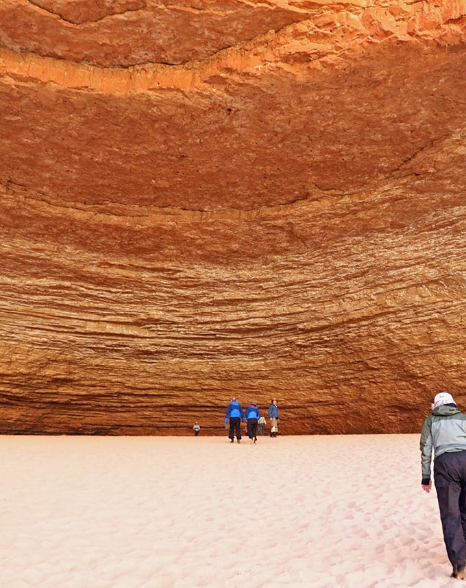 Talk about a room with a view! These layered limestone walls tell Earth's story in chapters of amber and rust, making visitors feel delightfully small.
