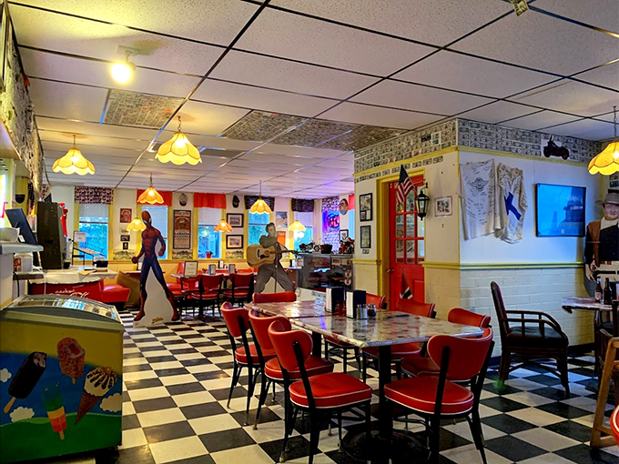 Step into a diner that's part time capsule, part fever dream. With its checkered floors and Spiderman cutout, it's like the '50s and Marvel had a delicious love child.