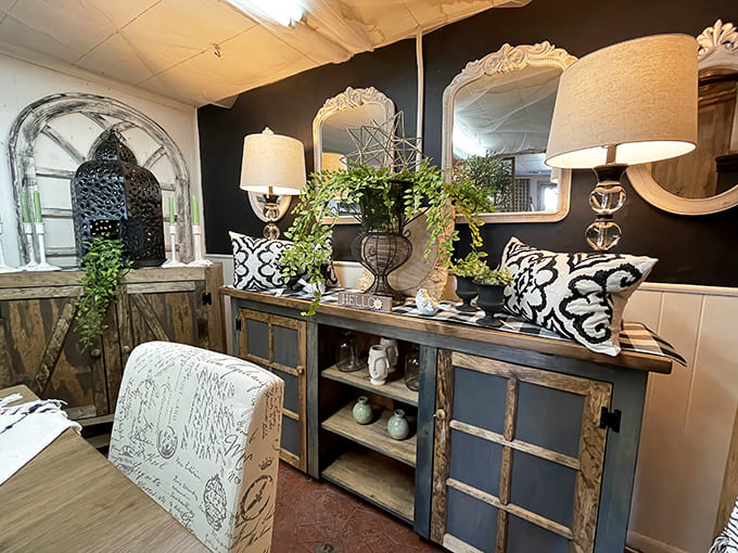 This elegant cabinet arrangement showcases the market's flair for creating inviting vignettes &ndash; black walls dramatically highlighting ornate mirrors and sophisticated home accents.