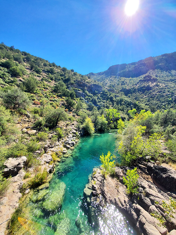 Desert meets oasis: The dramatic contrast between arid mountains and lush creek valley creates a landscape that defies Arizona stereotypes.